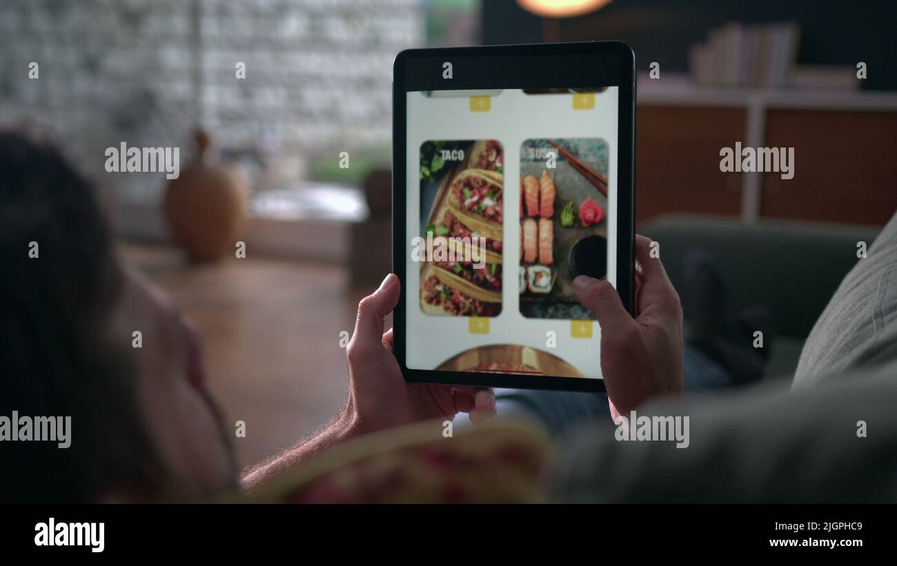 Man scrolling online menu browsing hi-res stock photography and images ...