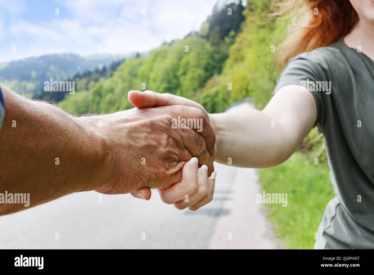 Man and woman shaking hands. Symbol of friendship, harmony and ...