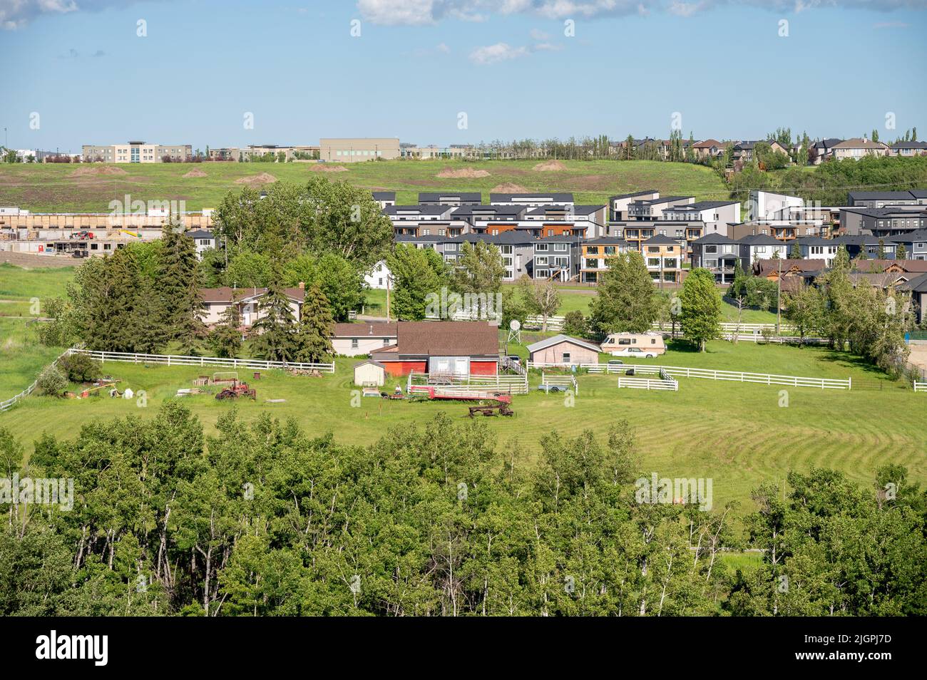 Views of new suburban construction encroaching on old farm acreages ...