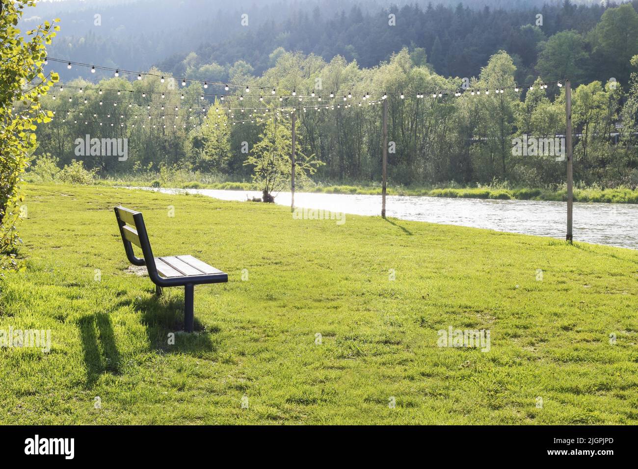 Wooden bench by the river. Beautiful, calm corner Stock Photo - Alamy
