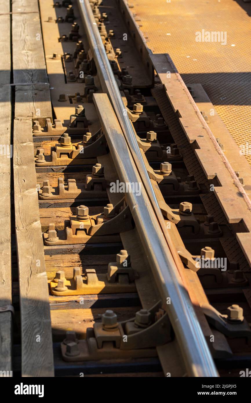 Connecting rails on the viaduct along the tracks Stock Photo - Alamy