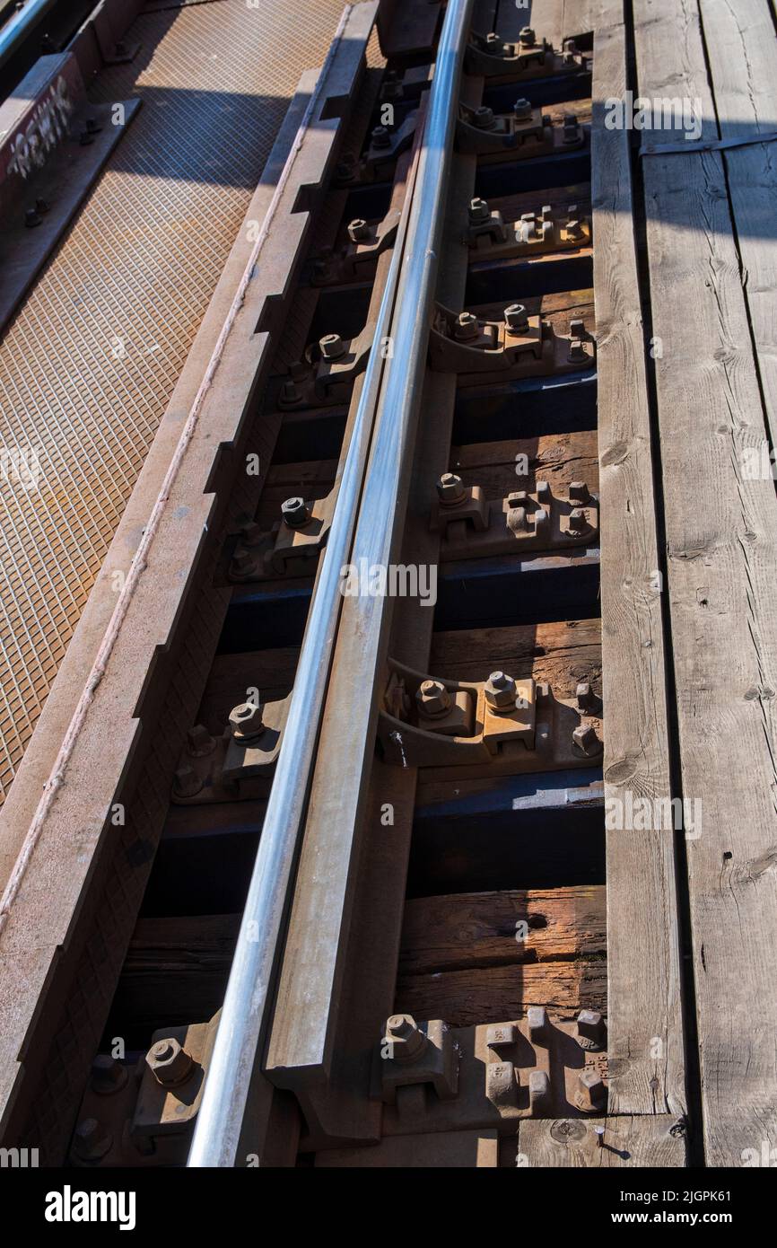 Connecting rails on the viaduct along the tracks Stock Photo - Alamy