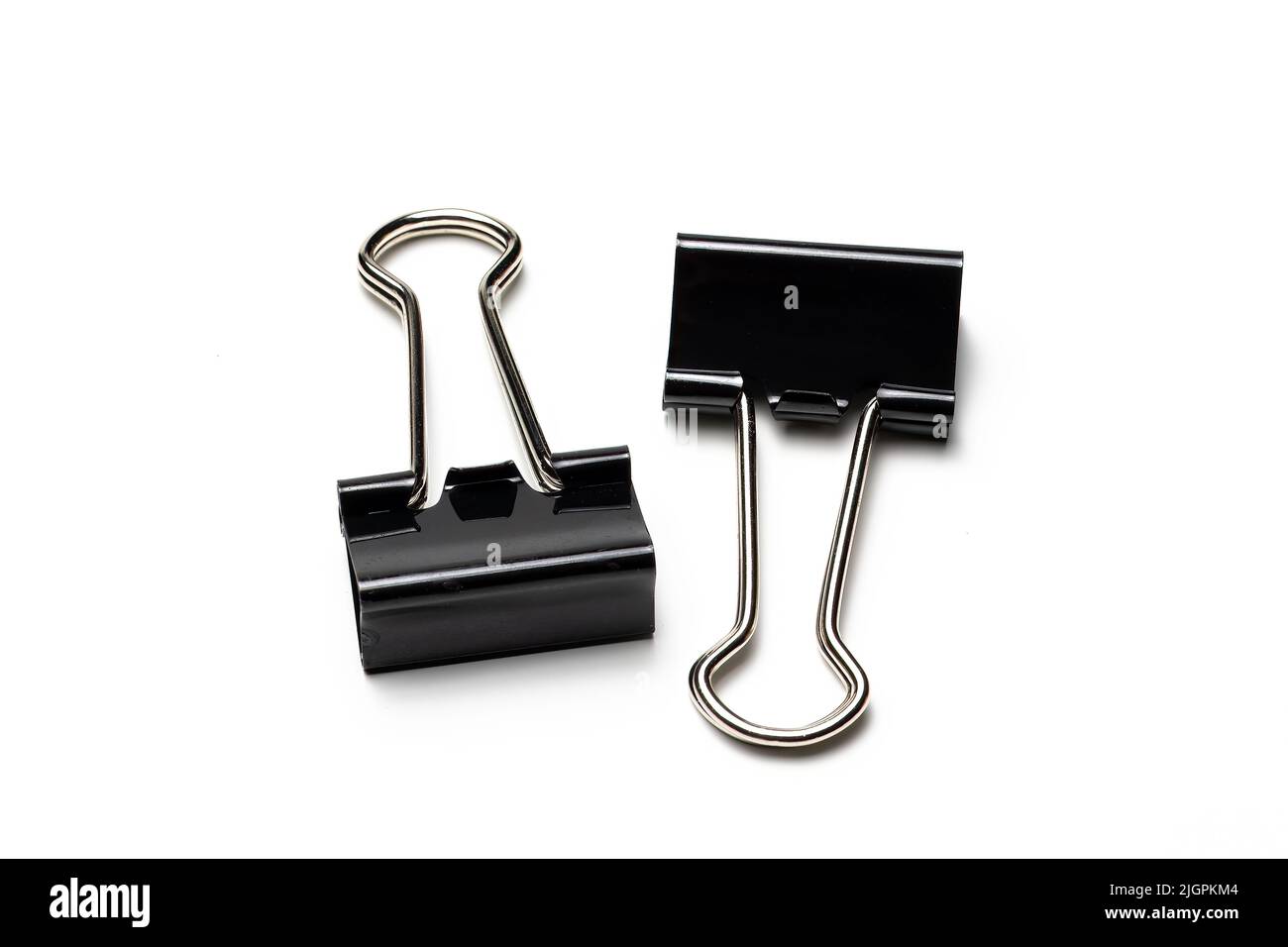 Binder clips on white background Stock Photo - Alamy