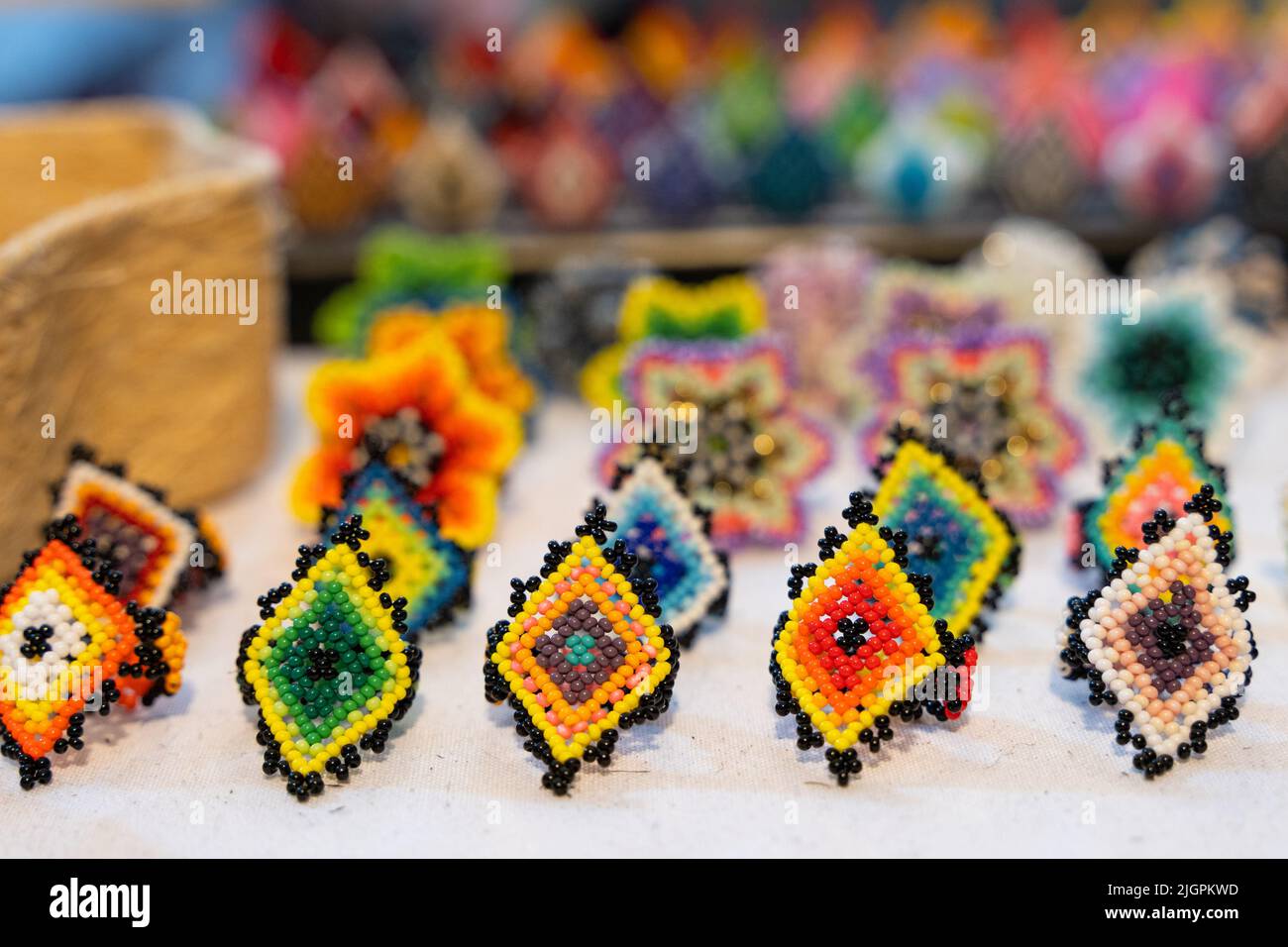 Colorful handmade huichol rings at night market in Guadalajara, Mexico ...
