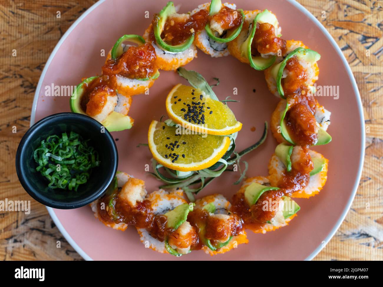 California sushi roll plate with avocado, prawn and spicy sauce view ...
