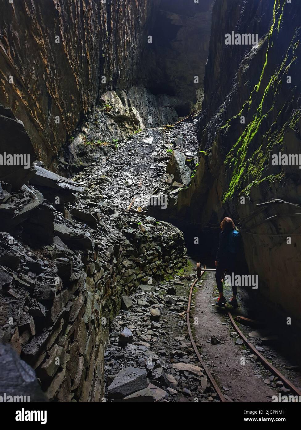 Urban explorer Gabrielle exploring the quarry. GWYNEDD, WALES. A FEMALE ...