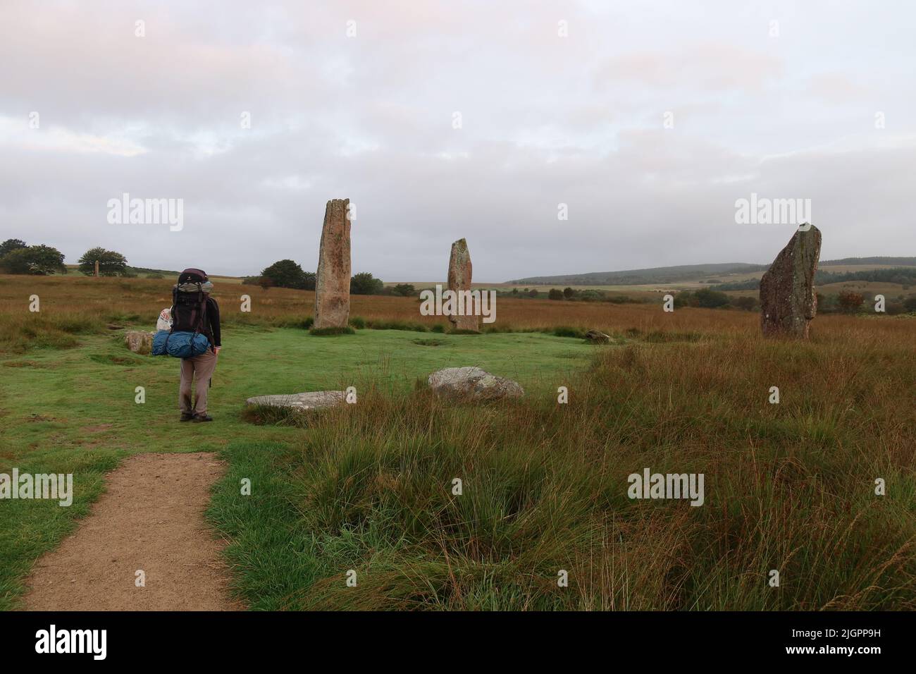 Solo Backpacker hiking with a big backpack. Arran Coastal Way. Isle of ...