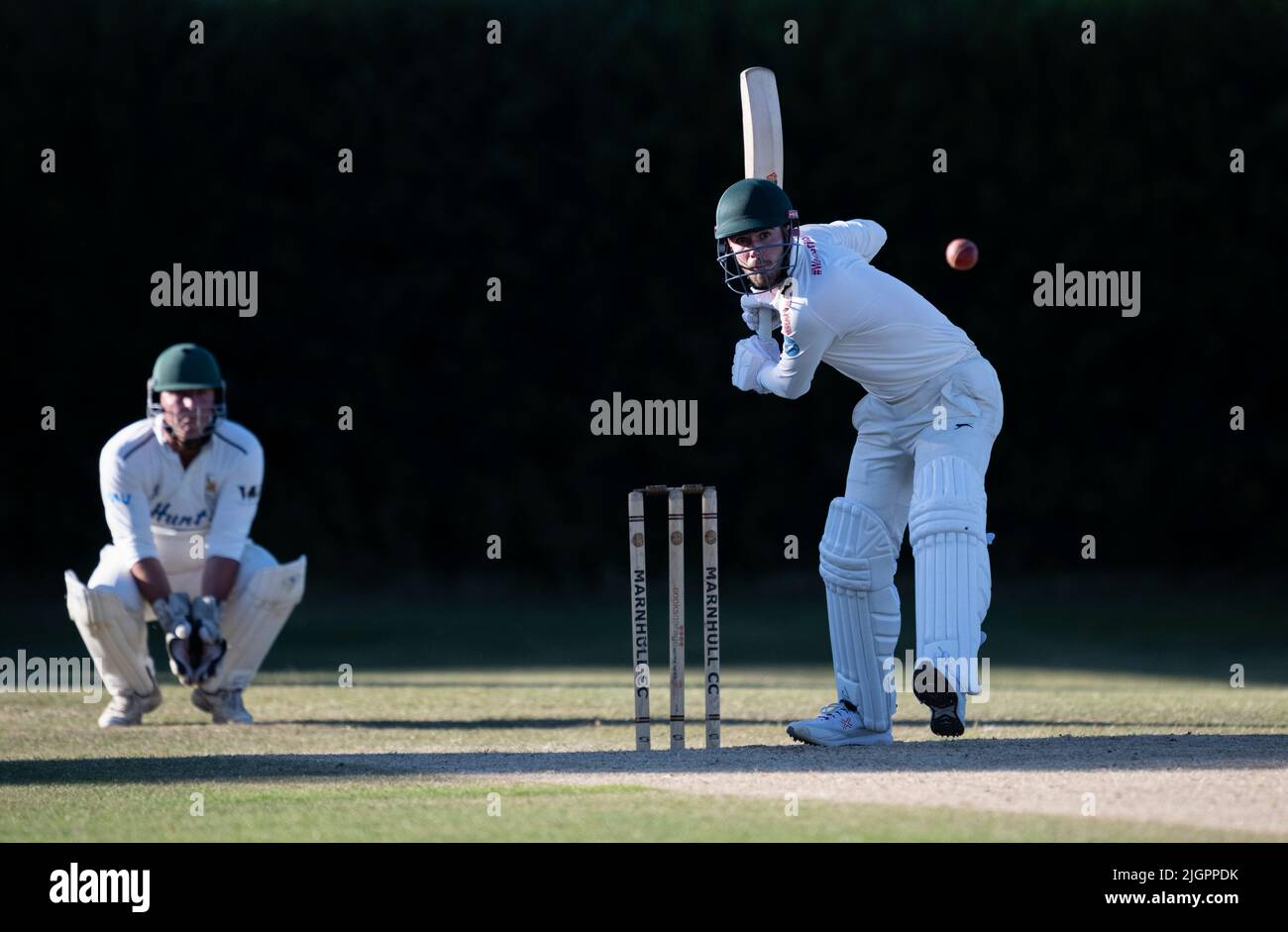 Cricket batter in action Stock Photo - Alamy