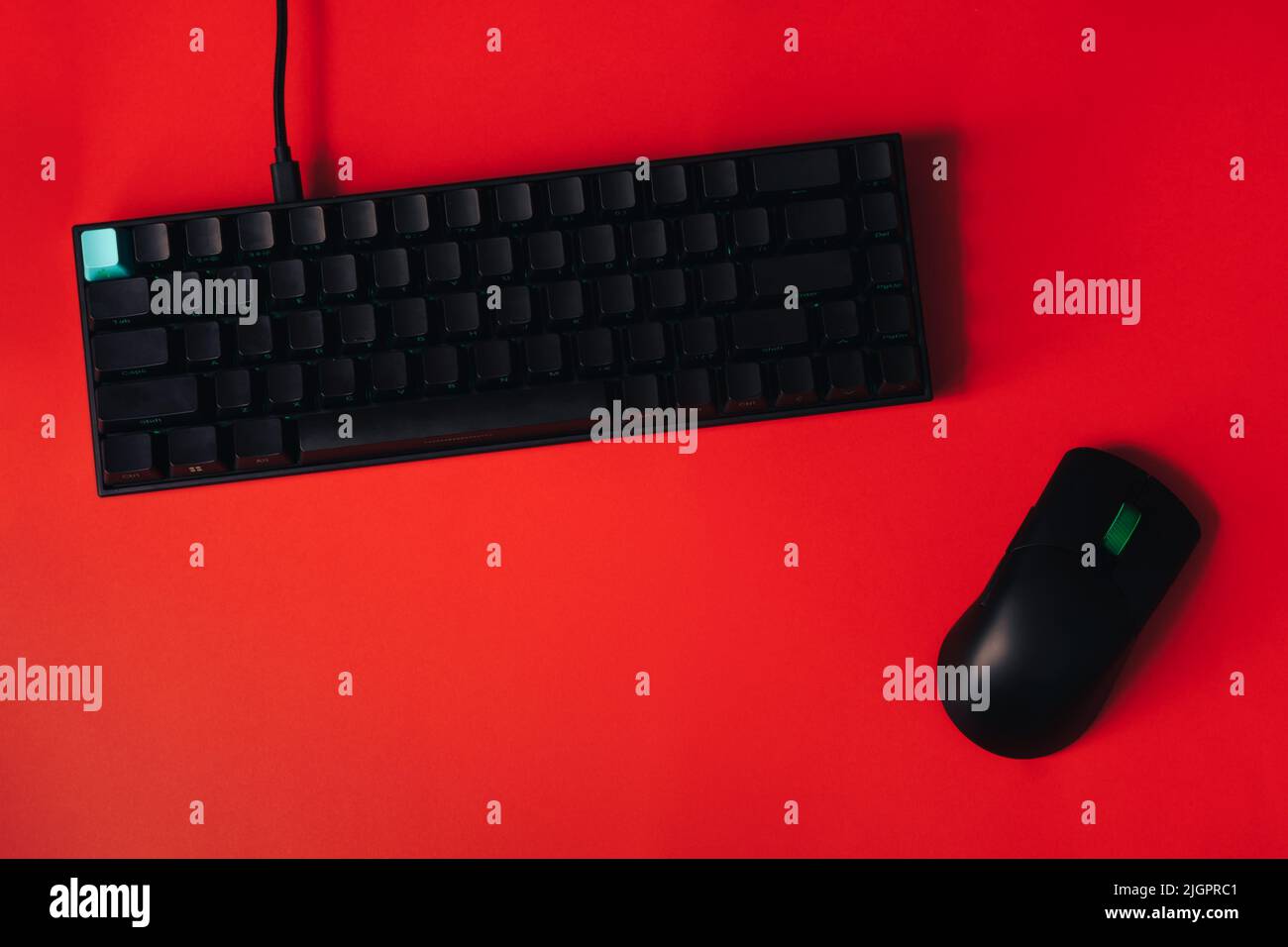 Computer gaming mouse and keyboard against red background Stock Photo ...