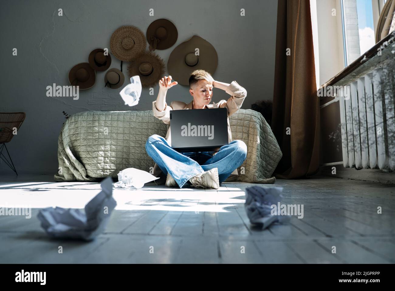 Woman professional content writer working with papers and laptop ...