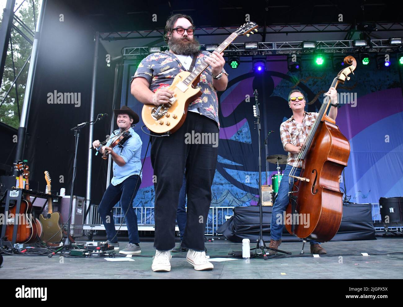 Old Crow Medicine Show band members are shown performing on stage ...