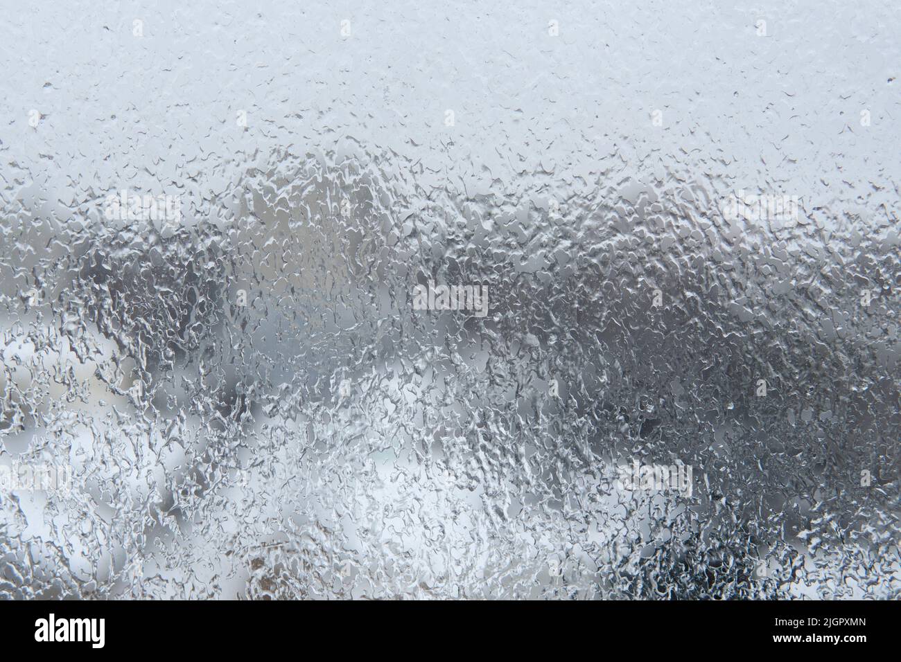 Beautiful festive frosted glass pattern. Ice on the window. Graceful ...
