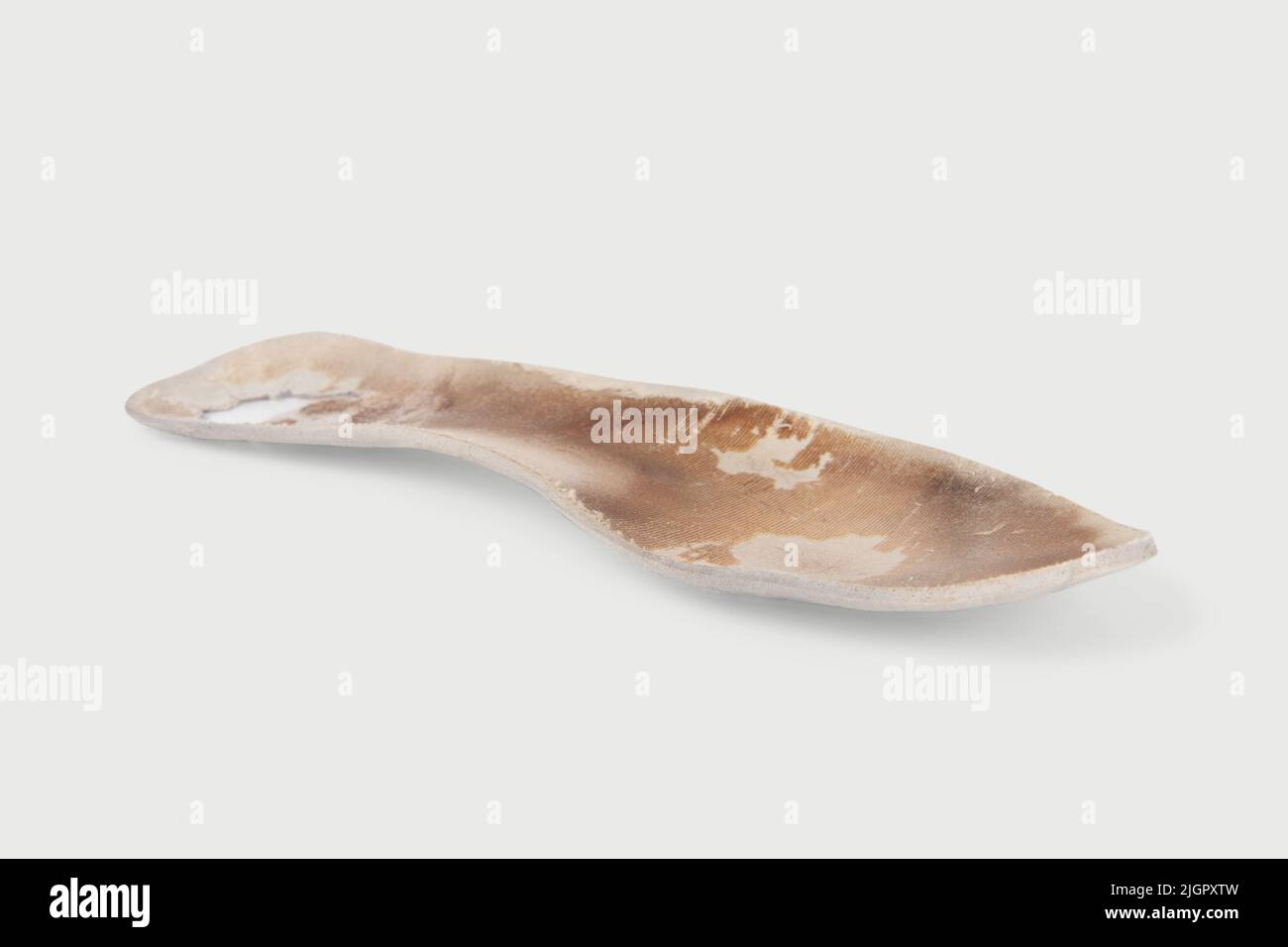 Old and shabby orthopedic insoles isolated on white background. Dirty ...