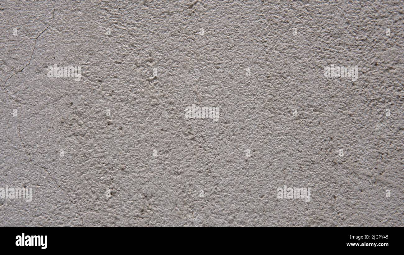 Gray texture of concrete wall of an old house with cracks. Decorative ...