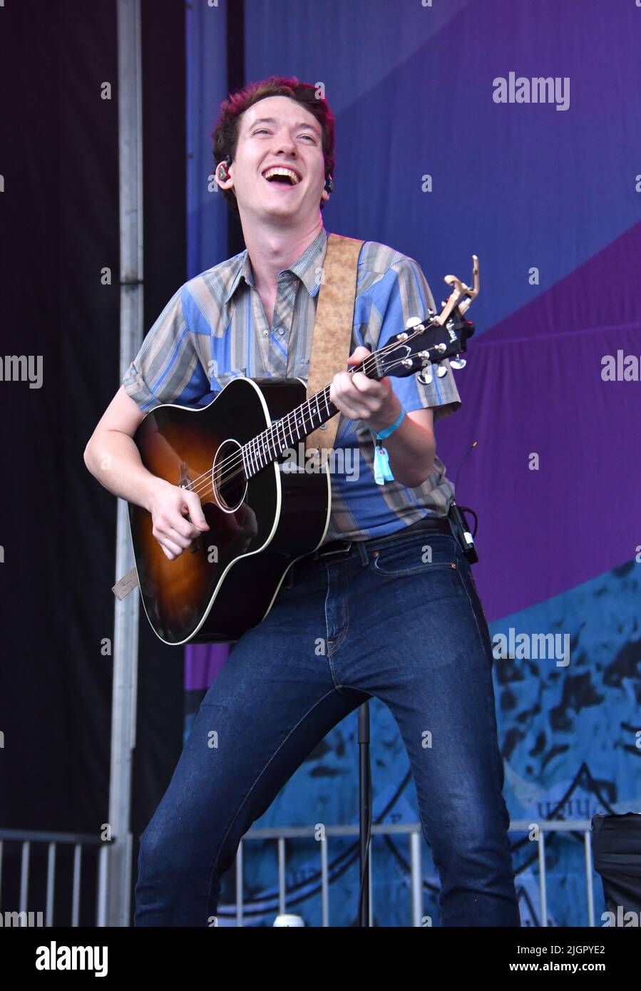 Singer and guitarist Mason Via is shown performing on stage during a ...