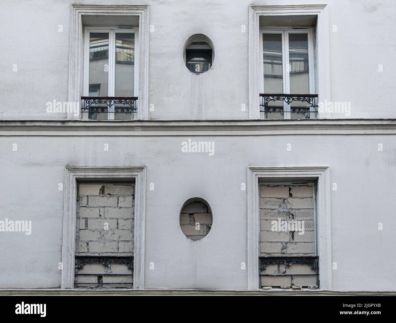closed windows in a partially abandoned building, Montmartre, Paris ...