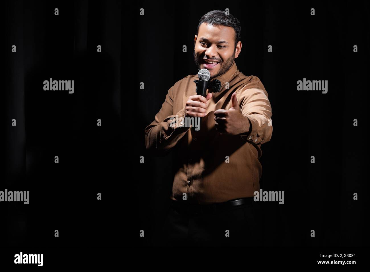 joyful middle east comedian showing like and performing stand up comedy ...