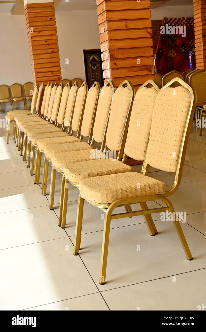 closeup the bunch yellow metal chairs in the row soft focus natural ...