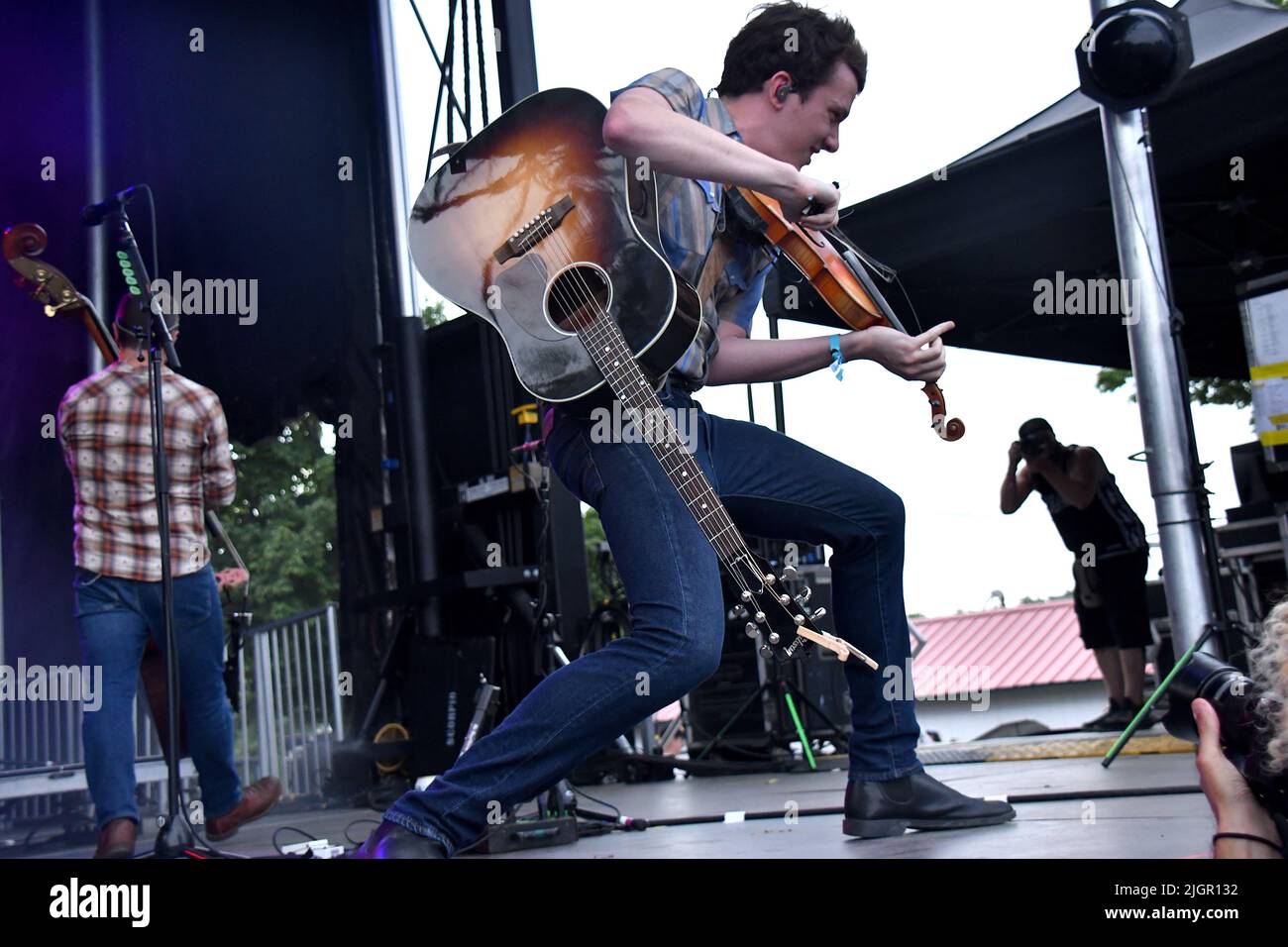 Singer and guitarist Mason Via is shown performing on stage during a ...