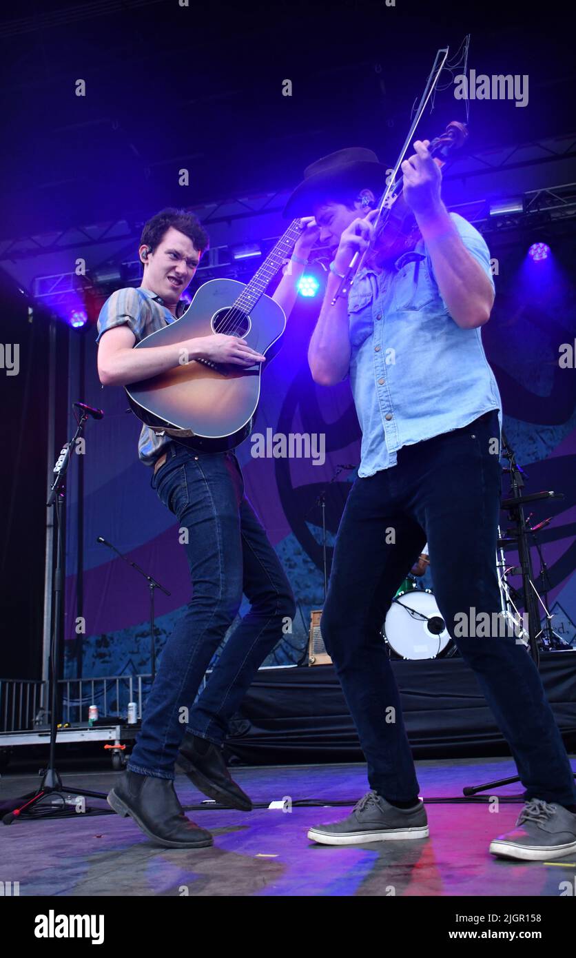 Old Crow Medicine Show band members are shown performing on stage ...