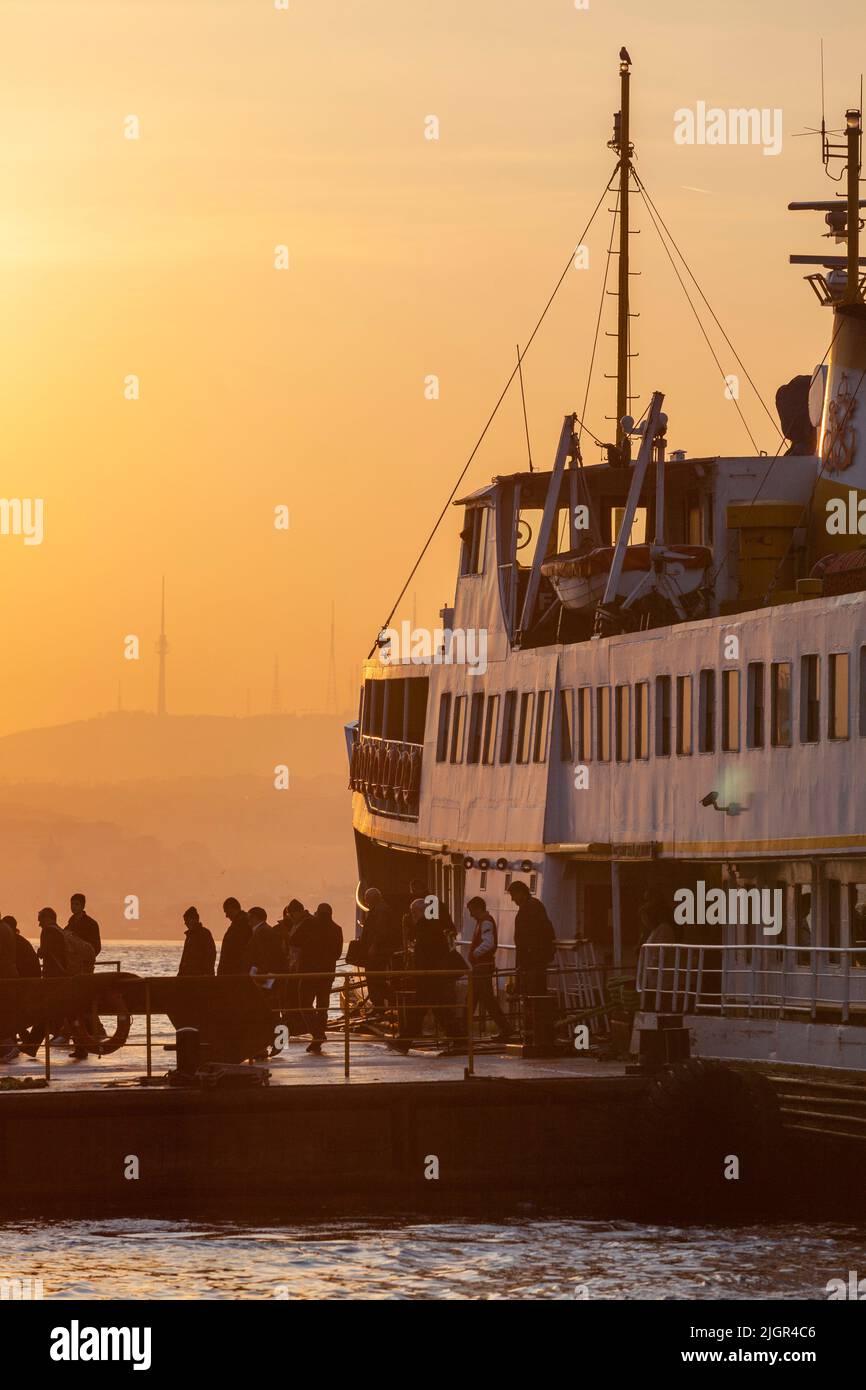 Early morning commuters departing ferry hi-res stock photography and ...