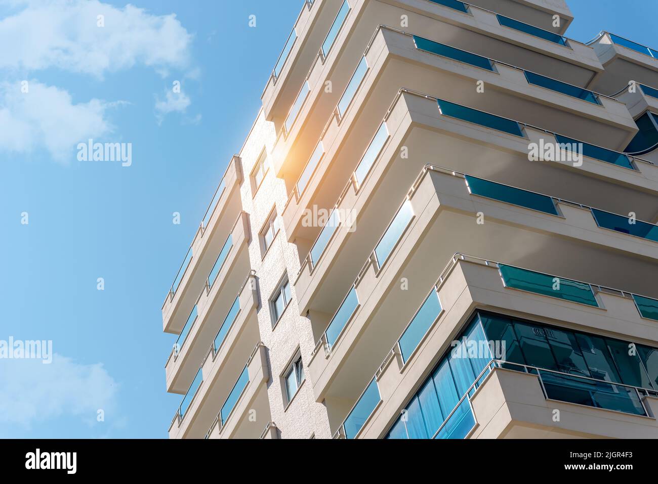 Corner of a residential block building against the sky. Modern Turkish ...