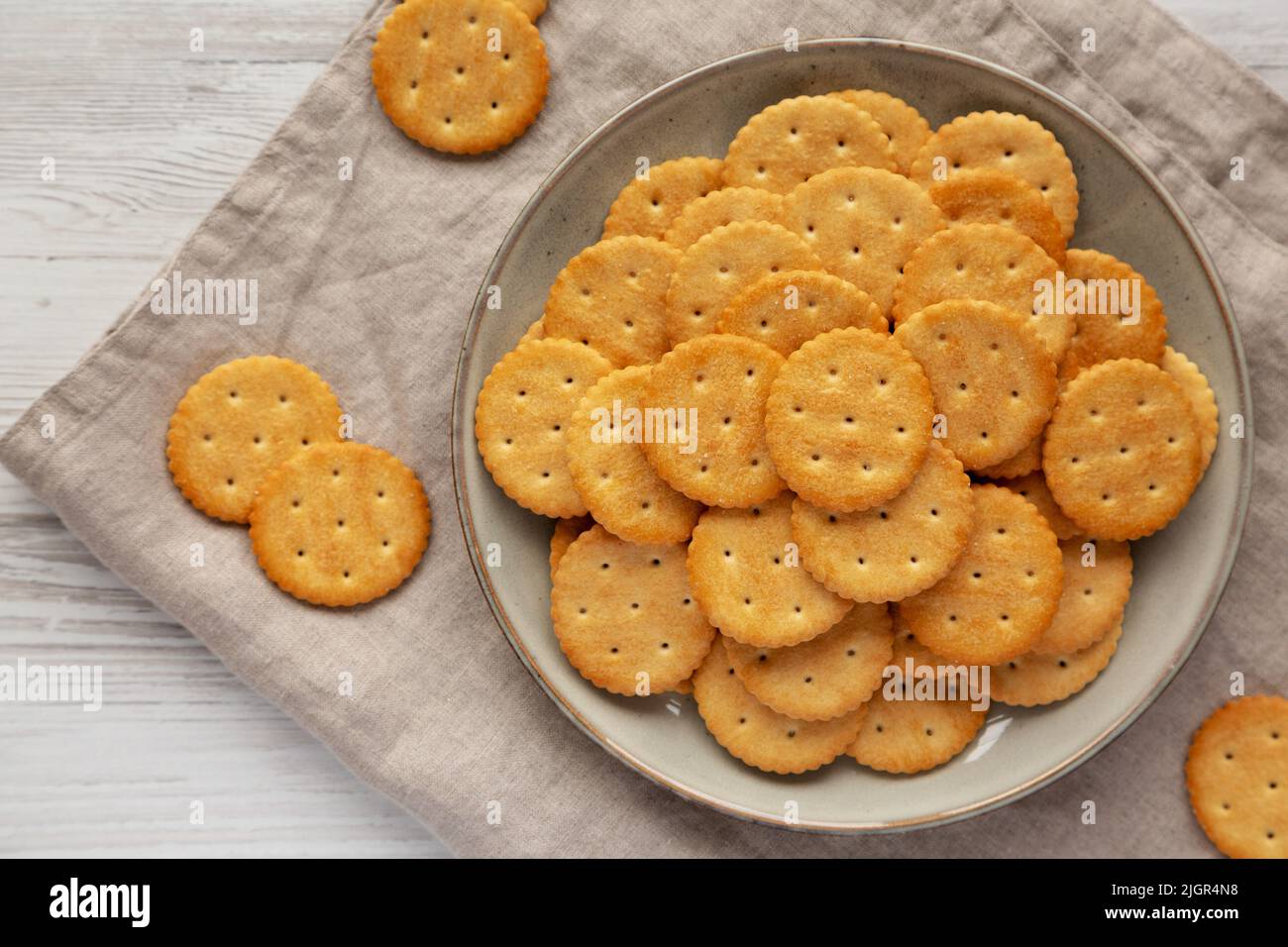 Salty Round Crackers on a Plate, top view. Flat lay, overhead, from ...