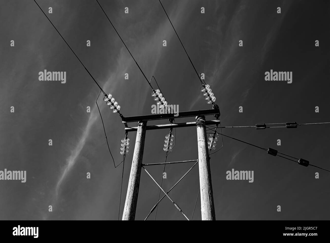 Utility (electricity) pylon set against a clear blue sky Stock Photo ...