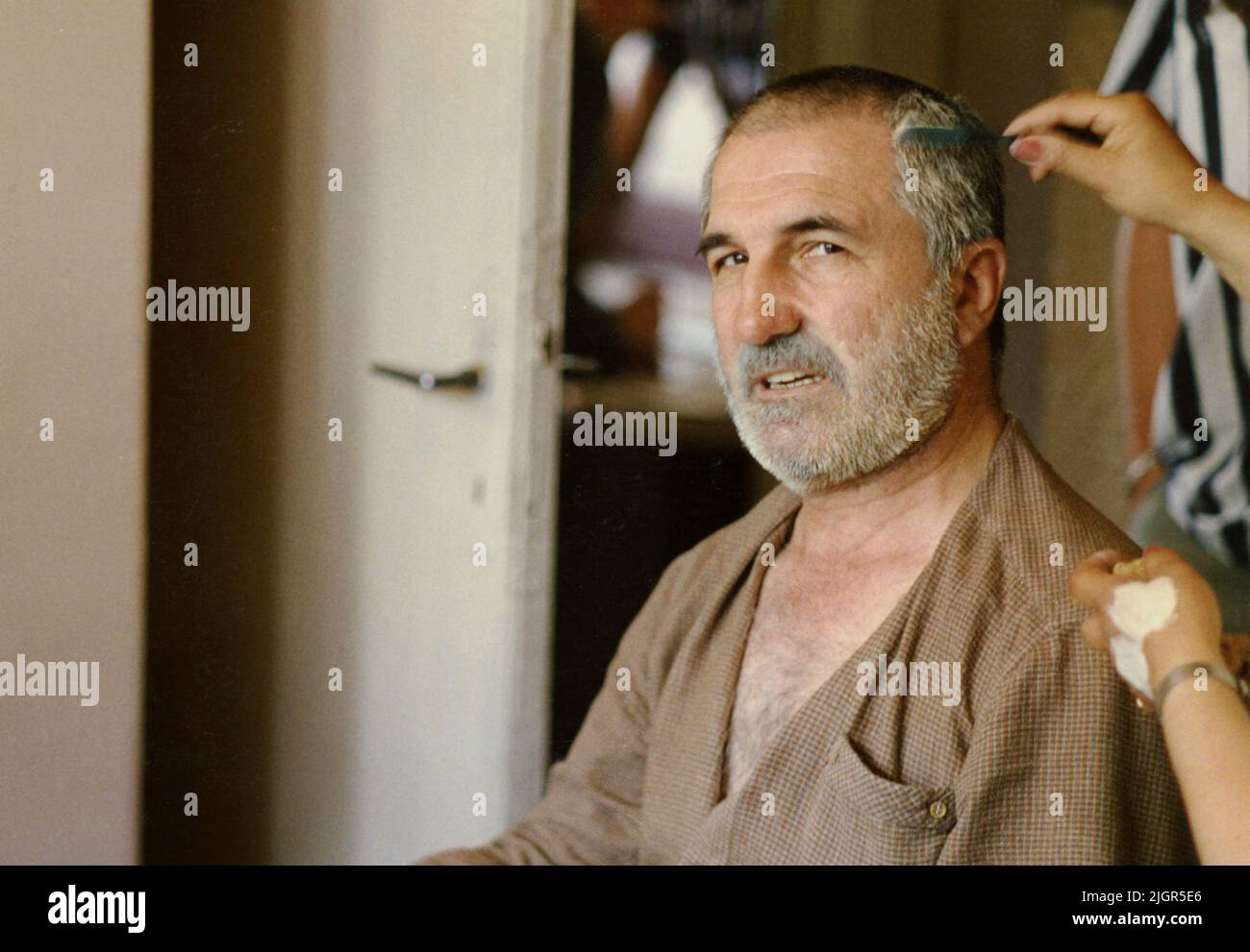The Romanian actor Gheorghe Dinica during a styling session for the ...