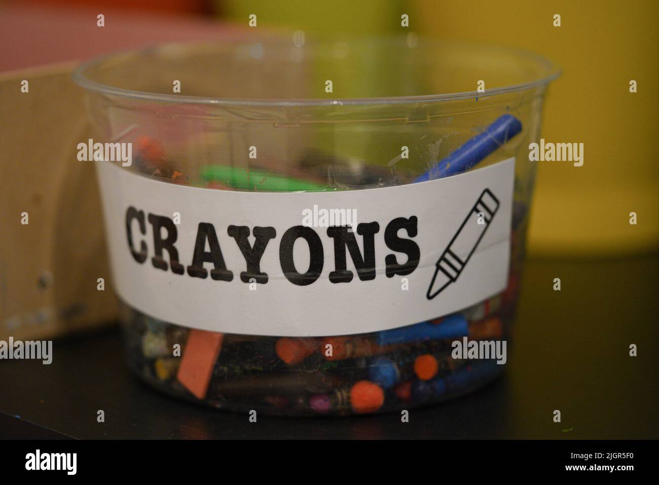 Crayons wax colors on a plastic box with crayons label at kids ...