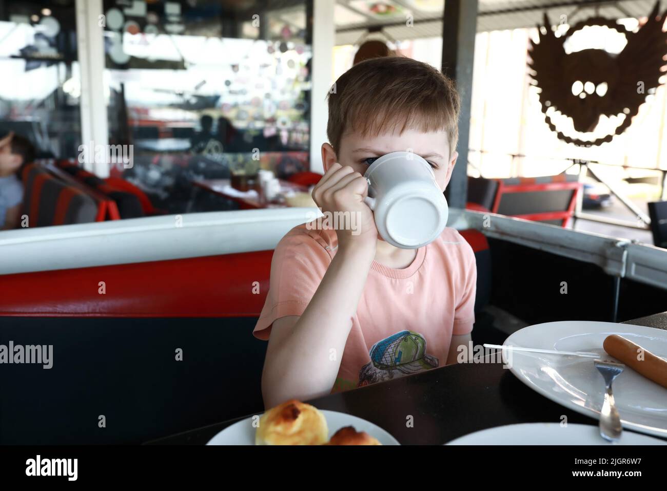 Boy table drinking tea hi-res stock photography and images - Alamy