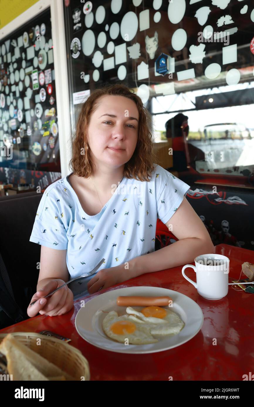 Portrait of woman has breakfast in restaurant Stock Photo - Alamy