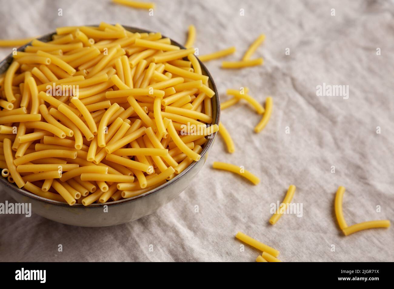 Dry Organic Maccheroni Pasta in a Bowl, side view. Space for text Stock ...