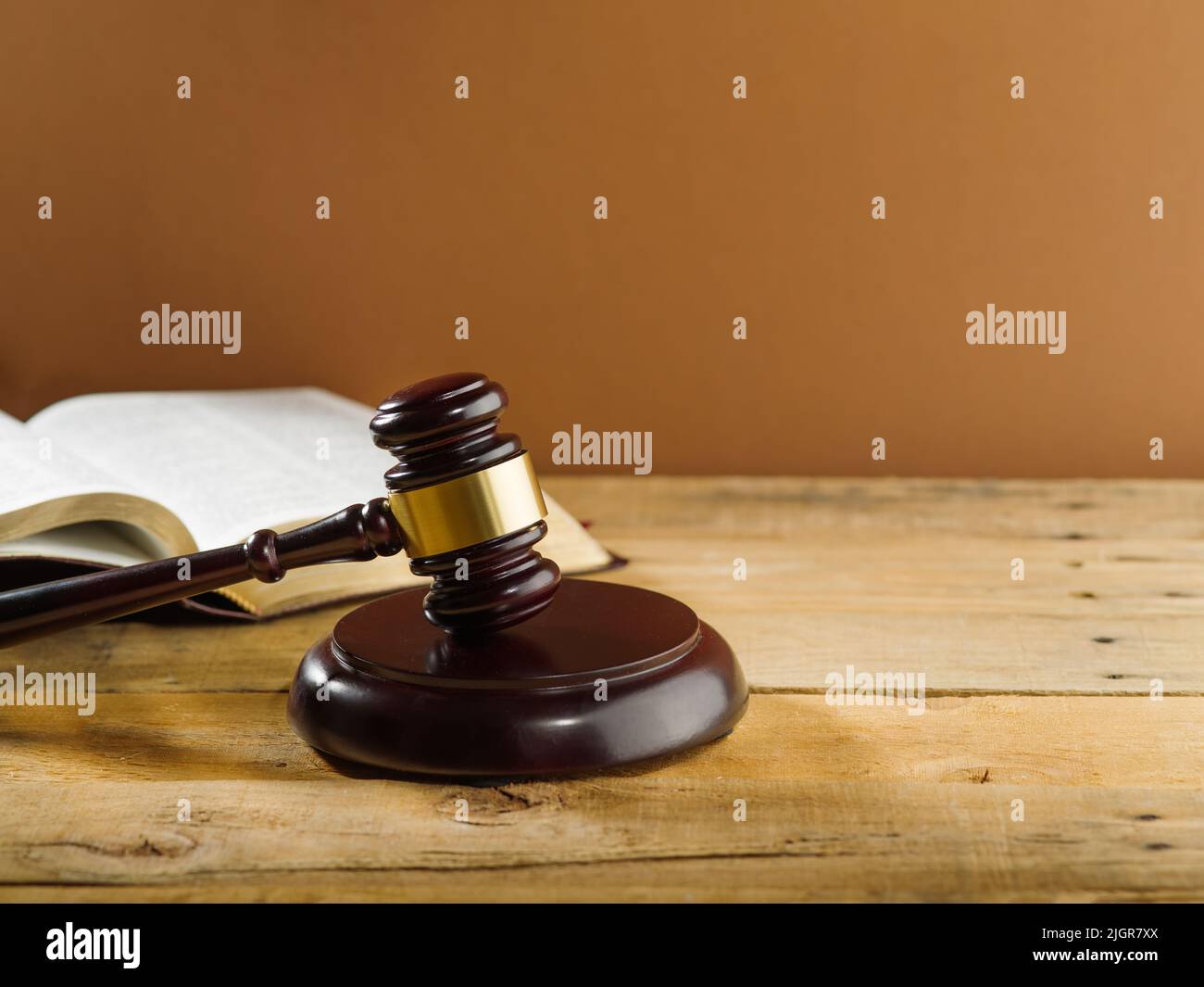 Judgment and justice. Judge's gavel on a wooden table and an open book ...
