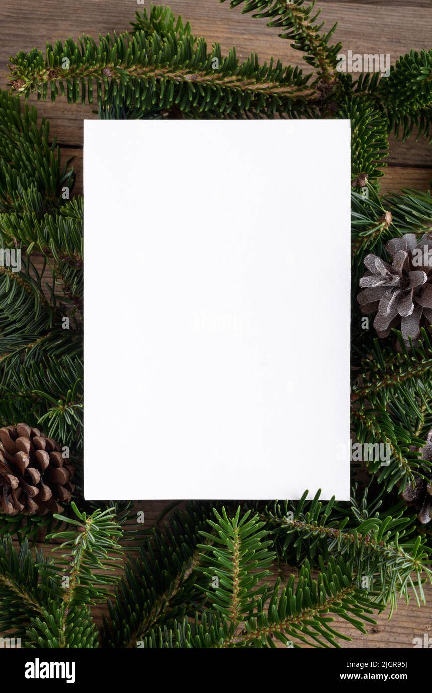 Christmas 5x7 card mockup template on natural fir twigs on wooden ...