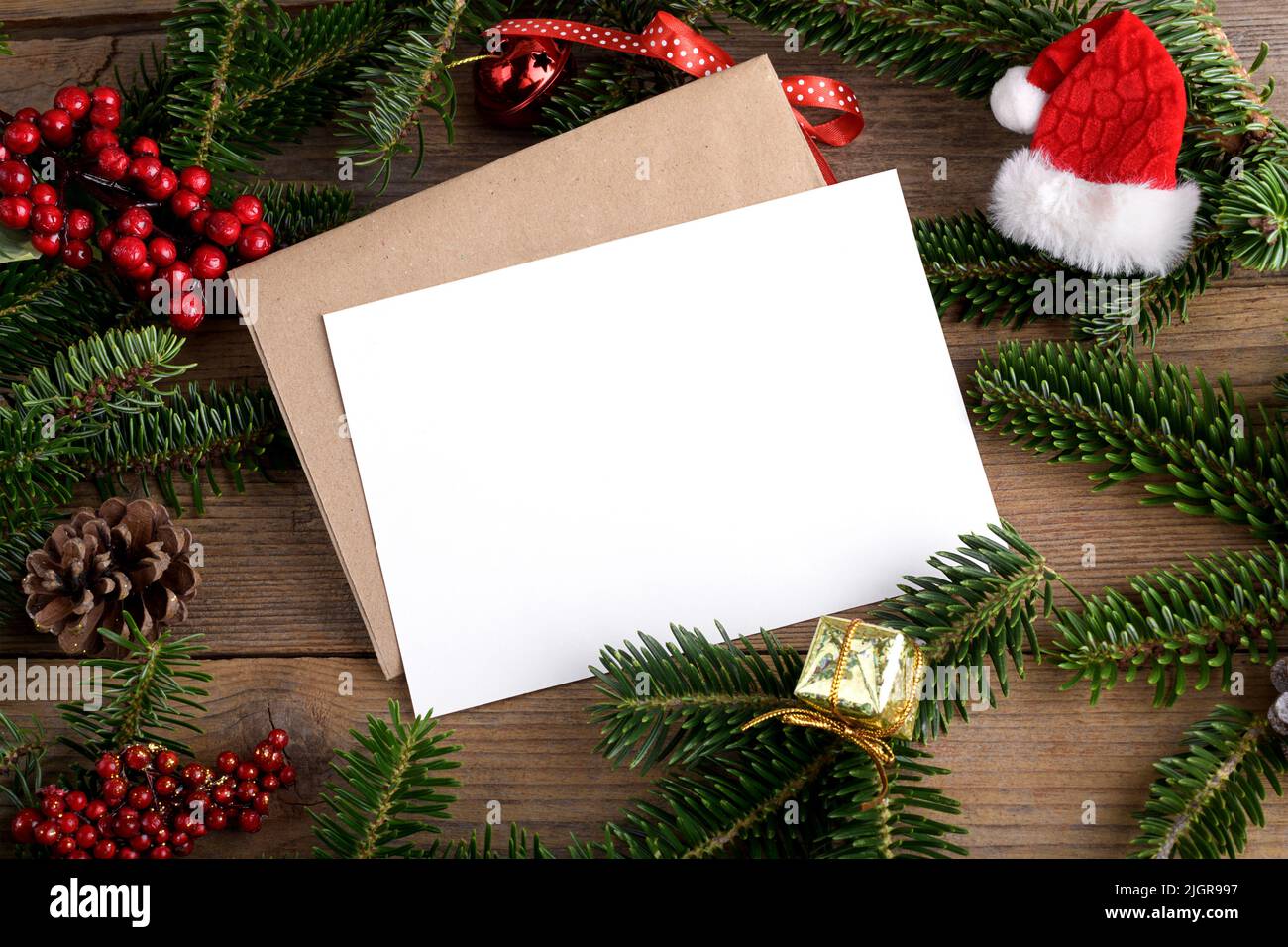 Christmas 7x5 card mockup template with envelope with fir twigs and ...