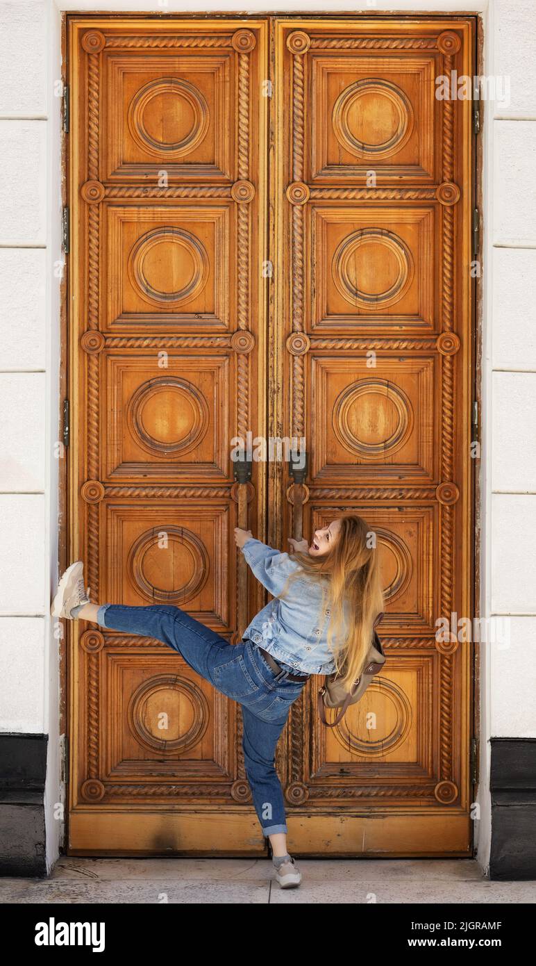 A screaming woman bursts into locked massive wooden doors with classic ...