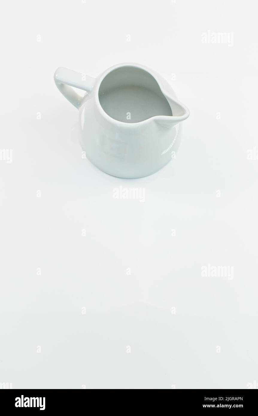 white kitchen table with empty milk jug view from above Stock Photo - Alamy