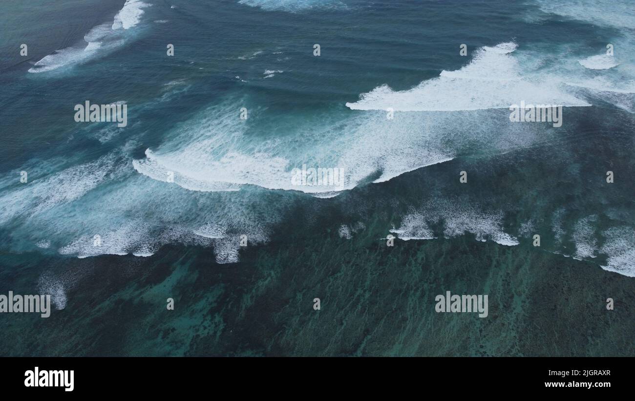 An aerial view of sea waves crashing Stock Photo - Alamy