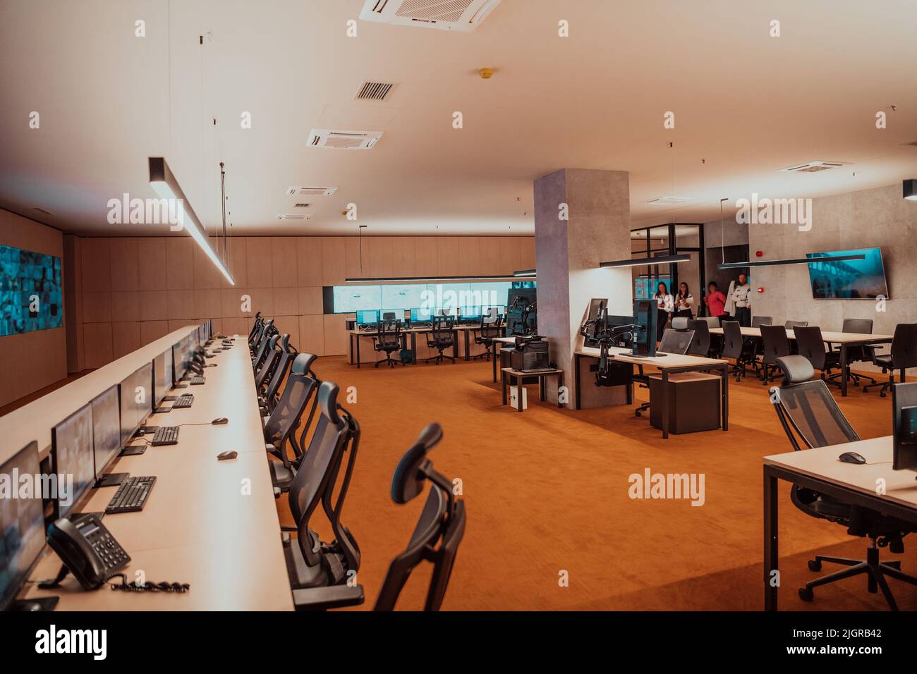 Empty interior of big modern security system control room, workstation ...