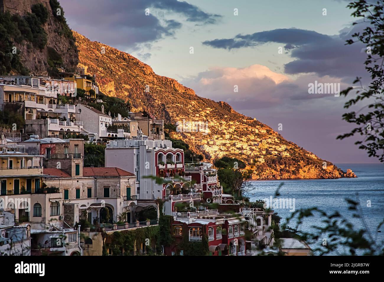 A scenic view of the town of Praiano in Italy in sunset sky background ...