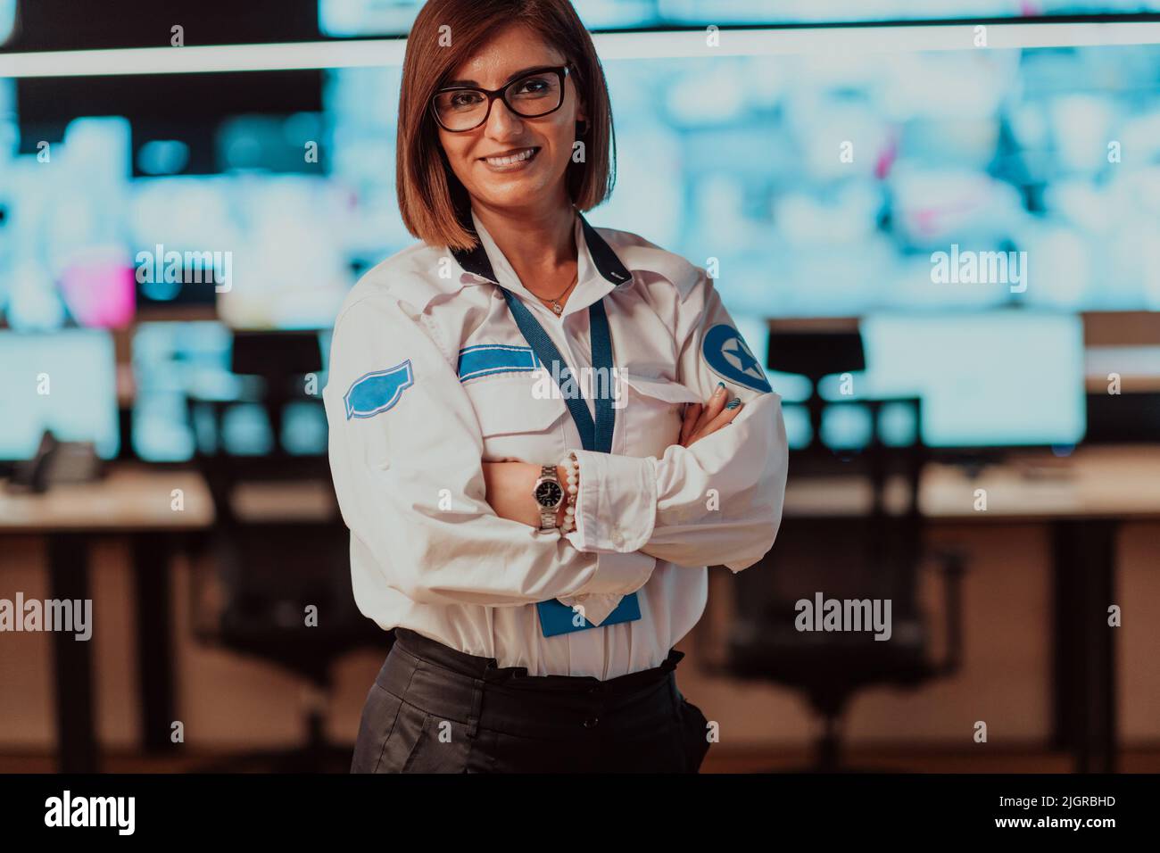 Portrait of female security operator while working in a data system ...