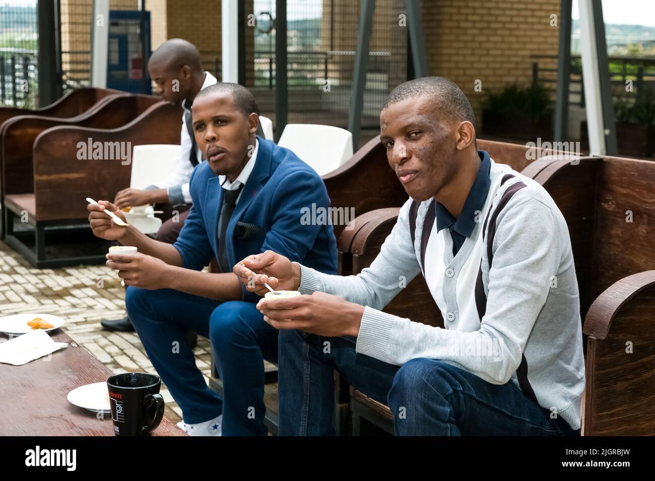 Two young male African students socializing on campus Stock Photo - Alamy