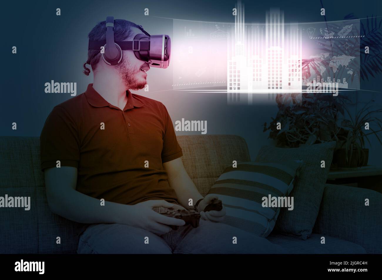 A view of a male playing a game using a virtual reality headset and ...
