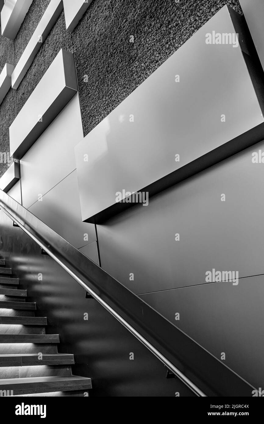 A vertical grayscale shot of a modern architecture stairway Stock Photo ...