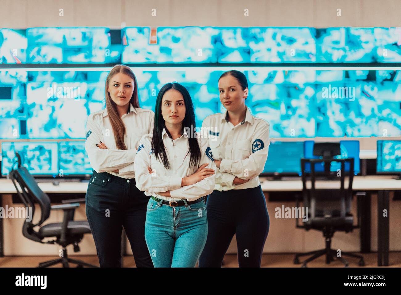 group portrait of female security operator while working in a data ...