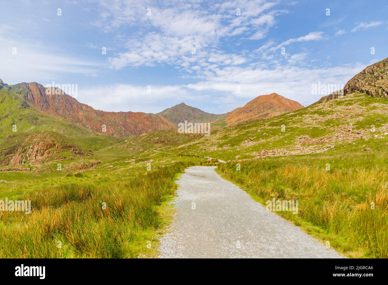 A scenic view of Snowdon mountain in Wales in cloudy sky background ...