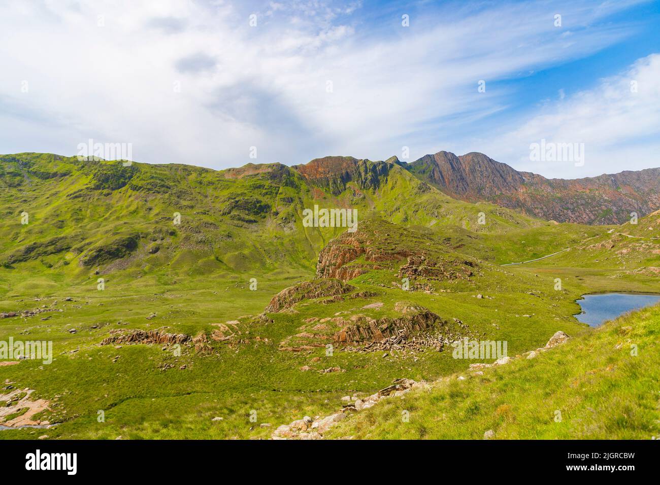 A scenic view of the Snowdon mountain in Wales in cloudy sky background ...