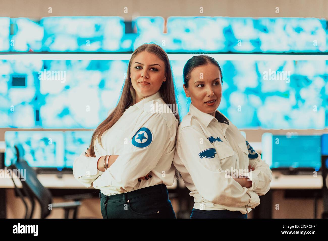 group portrait of female security operator while working in a data ...