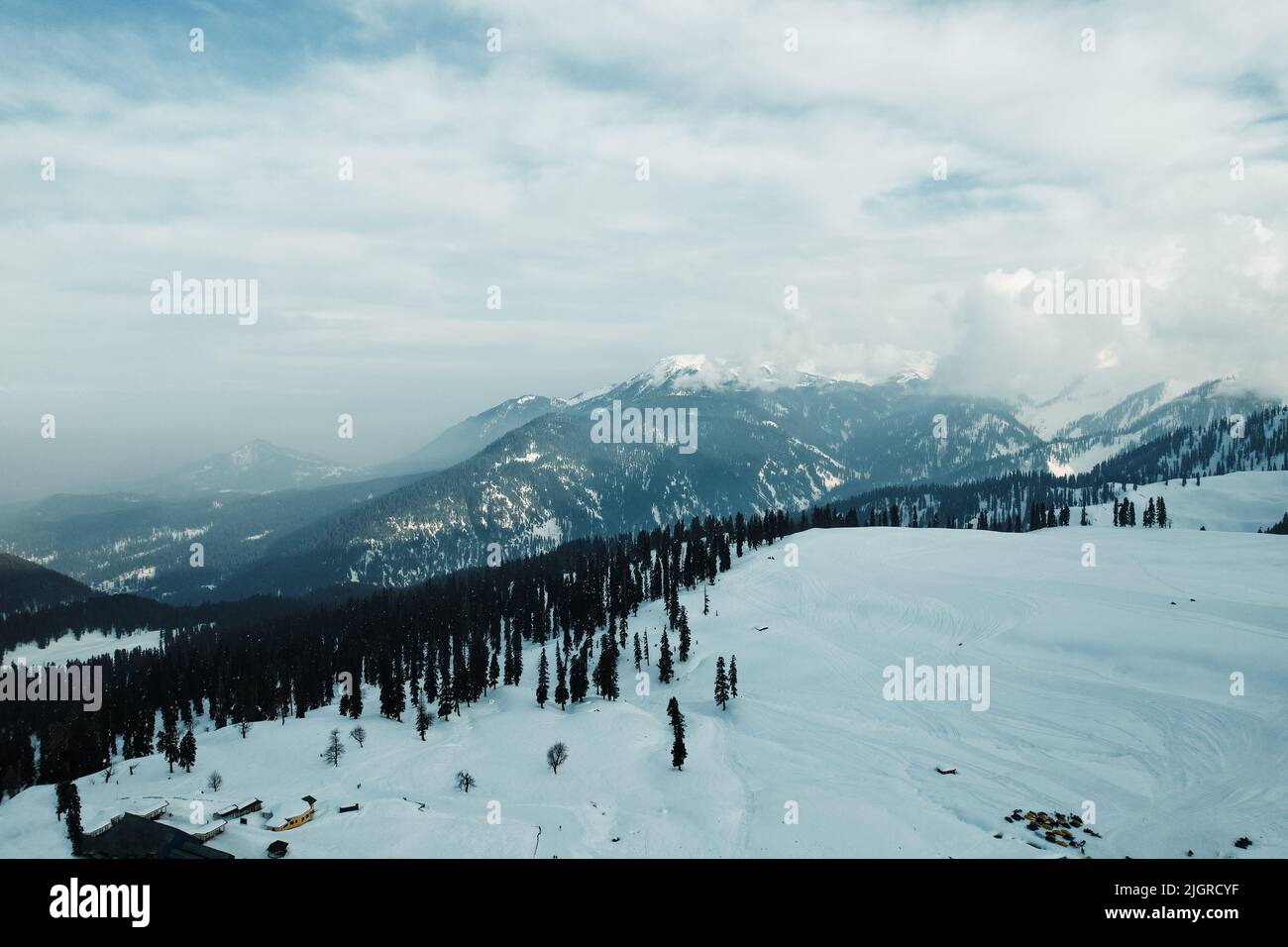 A beautiful view of hills and mountains with dense forests in a cold ...